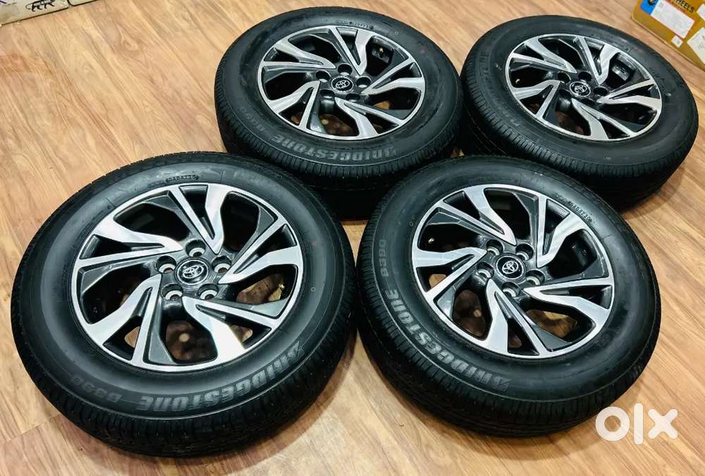 16 inch innova crysta dual tone alloys with Bridgestone TYRES Set of 4 ...