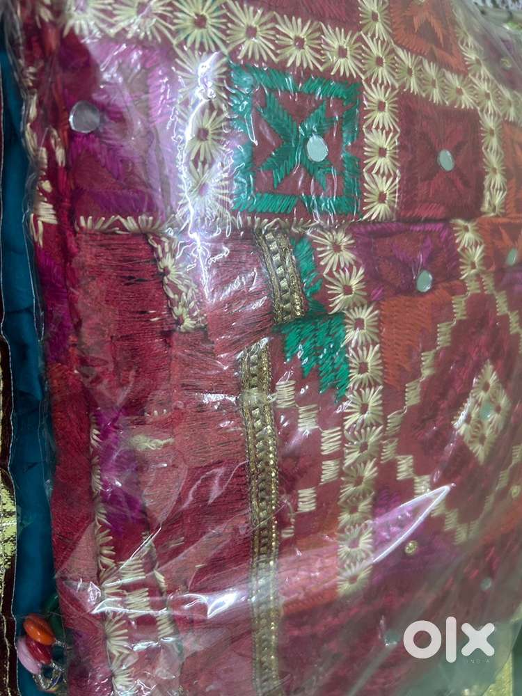 stich phulkari suit, one dress golden color and one red stich suit ...