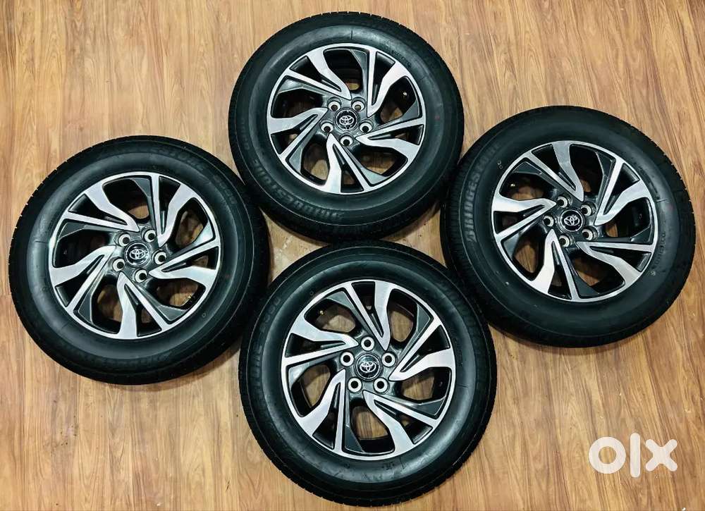 16 inch innova crysta dual tone alloys with Bridgestone TYRES Set of 4 ...